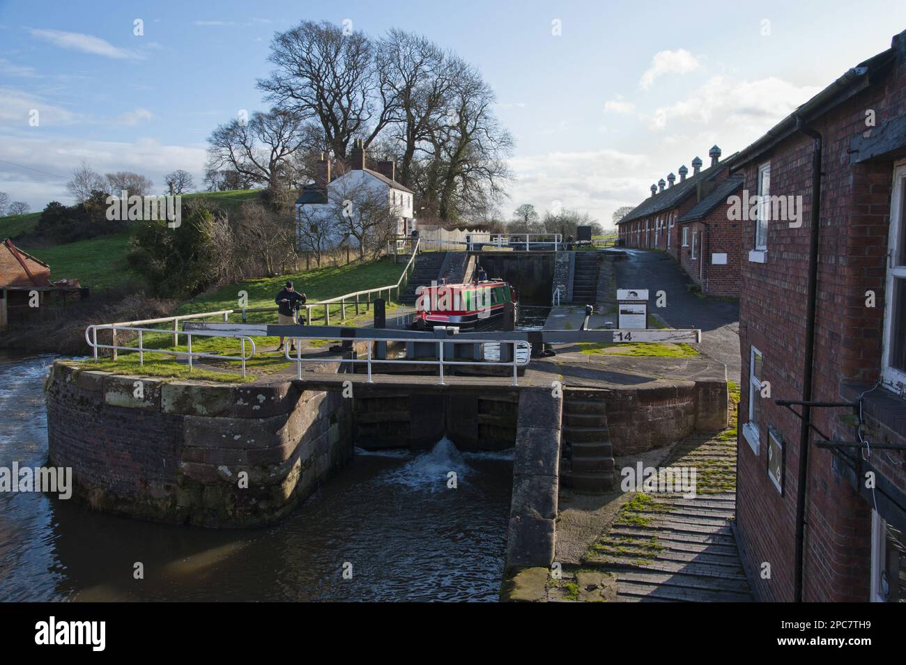 Narrowboat passing through the canal lock, Bunbury Locks, Shropshire ...