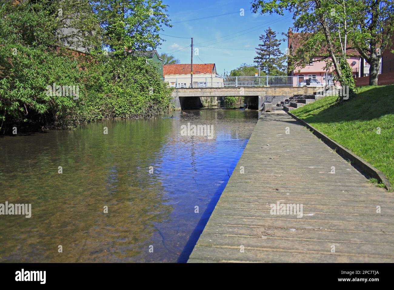 View of boardwalk alongside river in town, River Gipping, Stowmarket ...