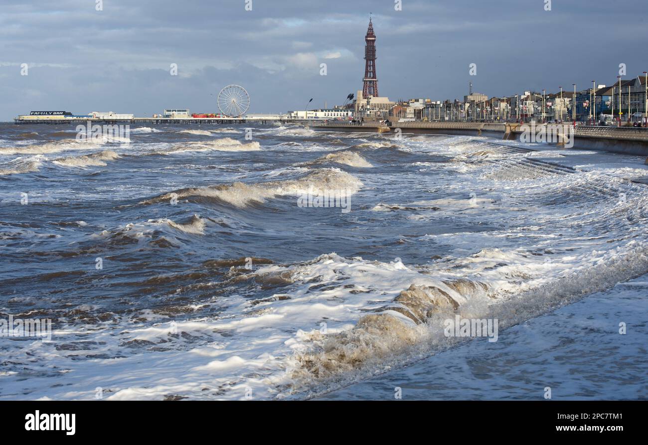 Stormy sea at high tide in seaside resort, Blackpool Tower in ...