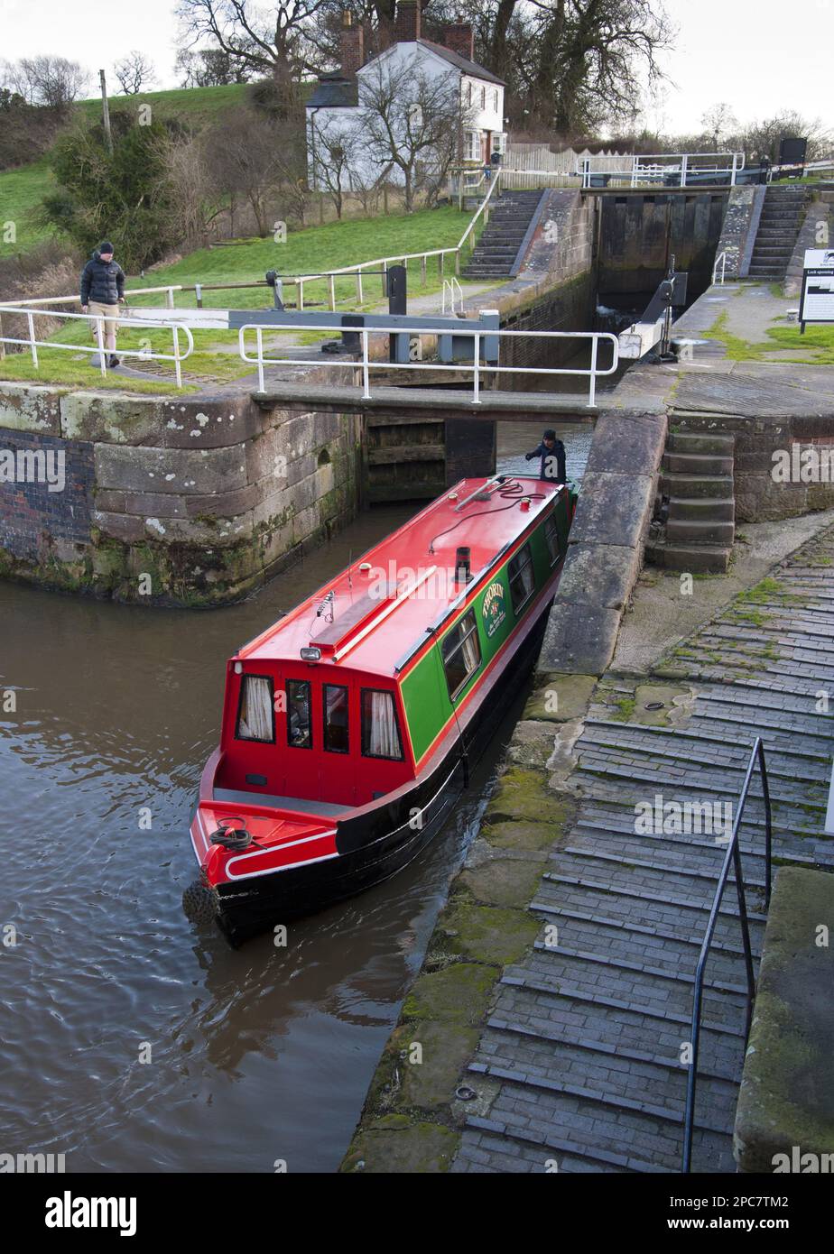 Narrowboat passing through the canal lock, Bunbury Locks, Shropshire ...