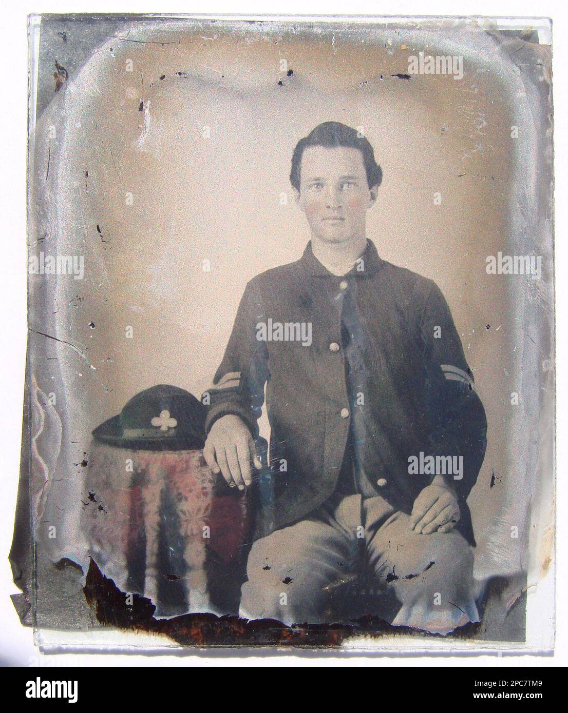 Unidentified soldier in Union corporal's uniform resting arm on table ...