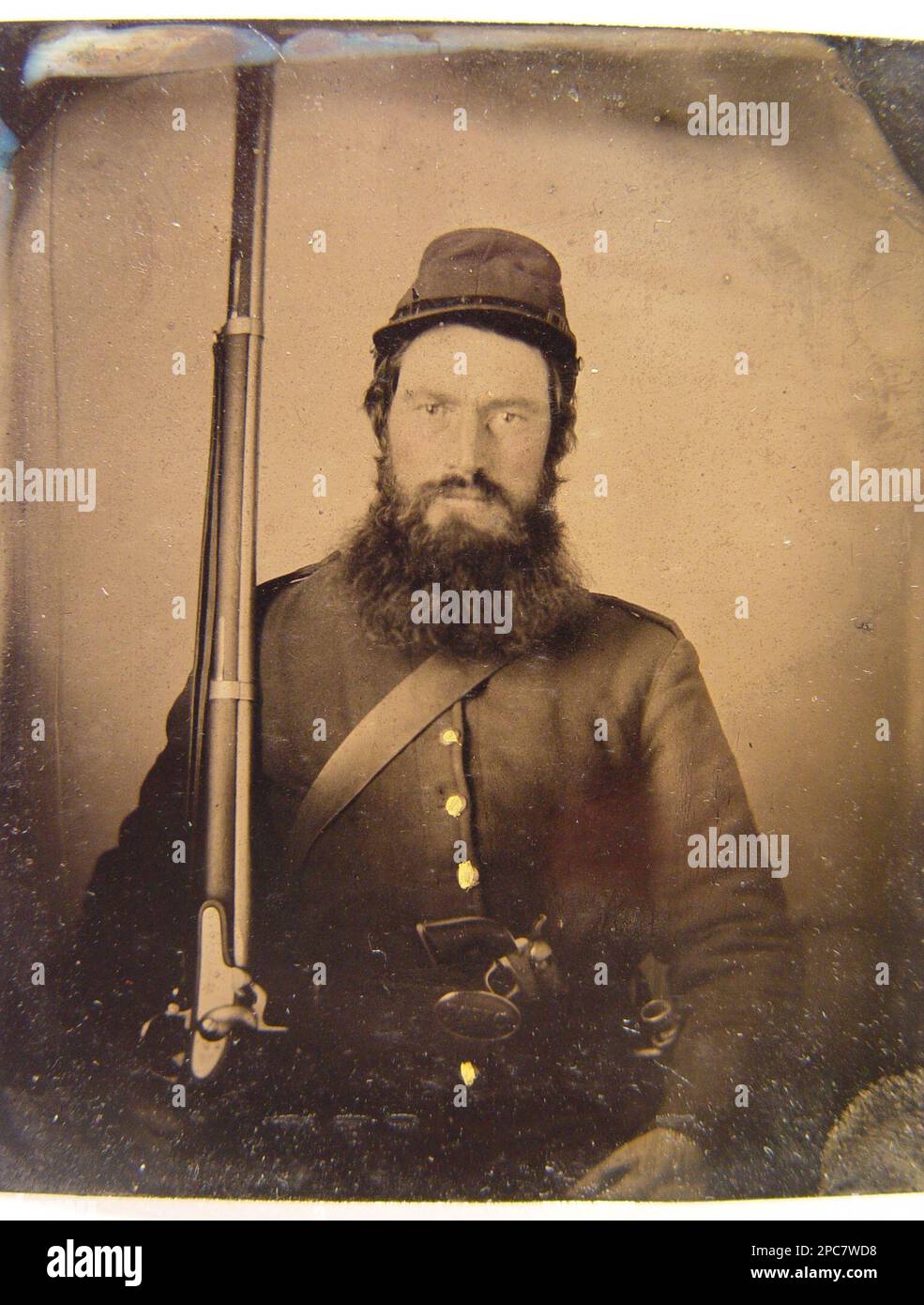 Unidentified soldier in Union uniform with musket, revolver, and ...
