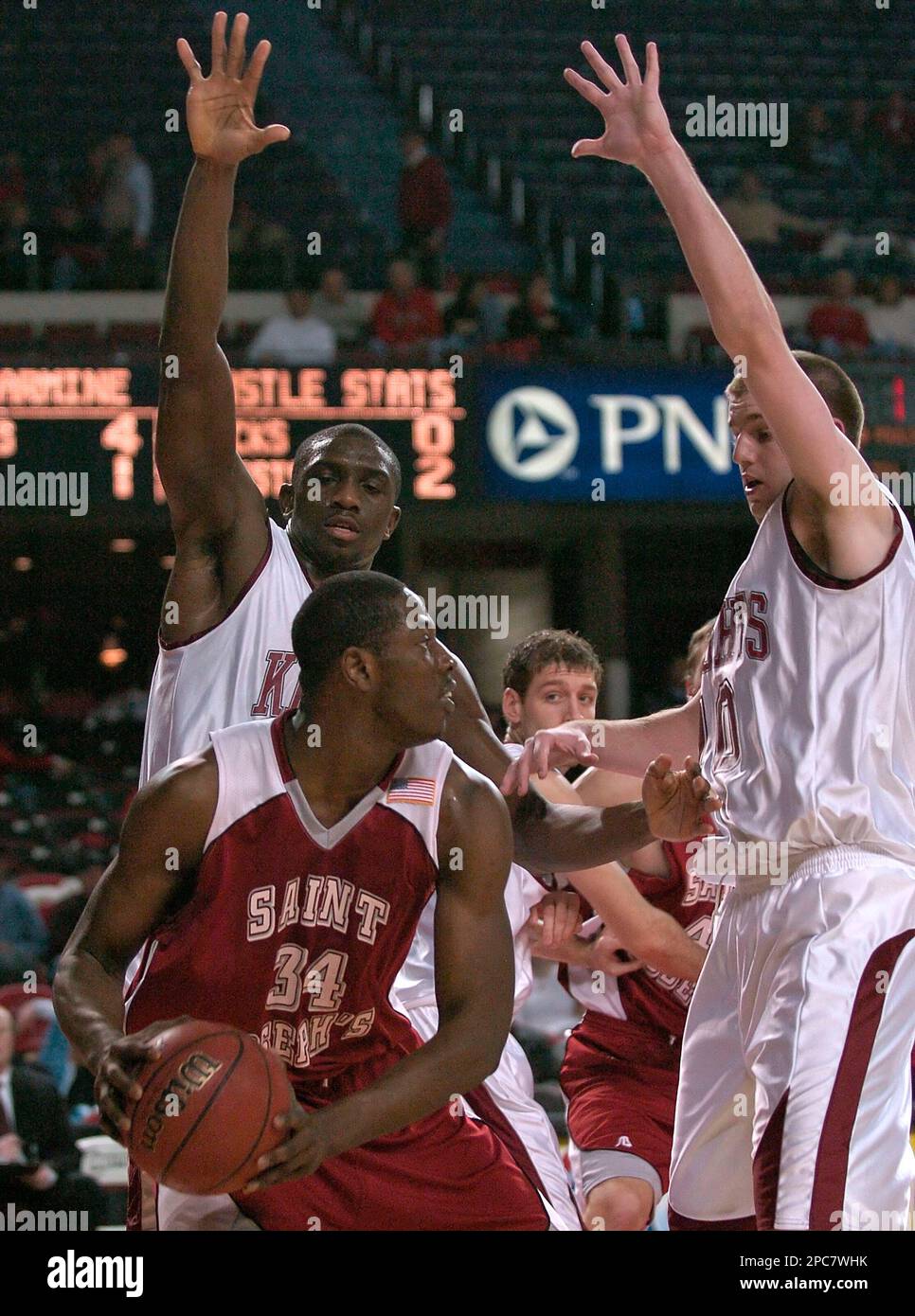 Bellarmine's Dzaflo Larkai, left, and Matt Otte, right block the ...