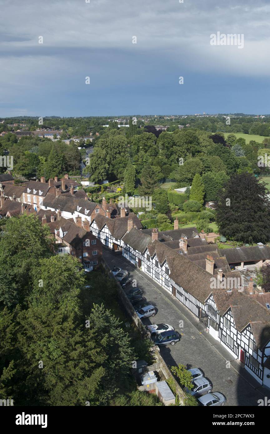 View from castle overlooking trees and town with old Tudor timber ...