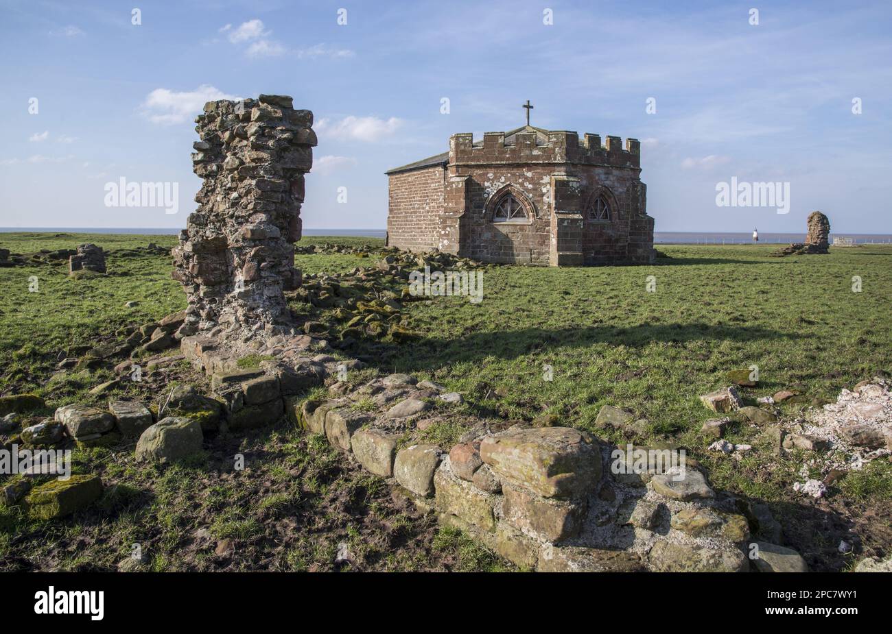 Ruined wall and chapter house in the grounds of the former abbey ...