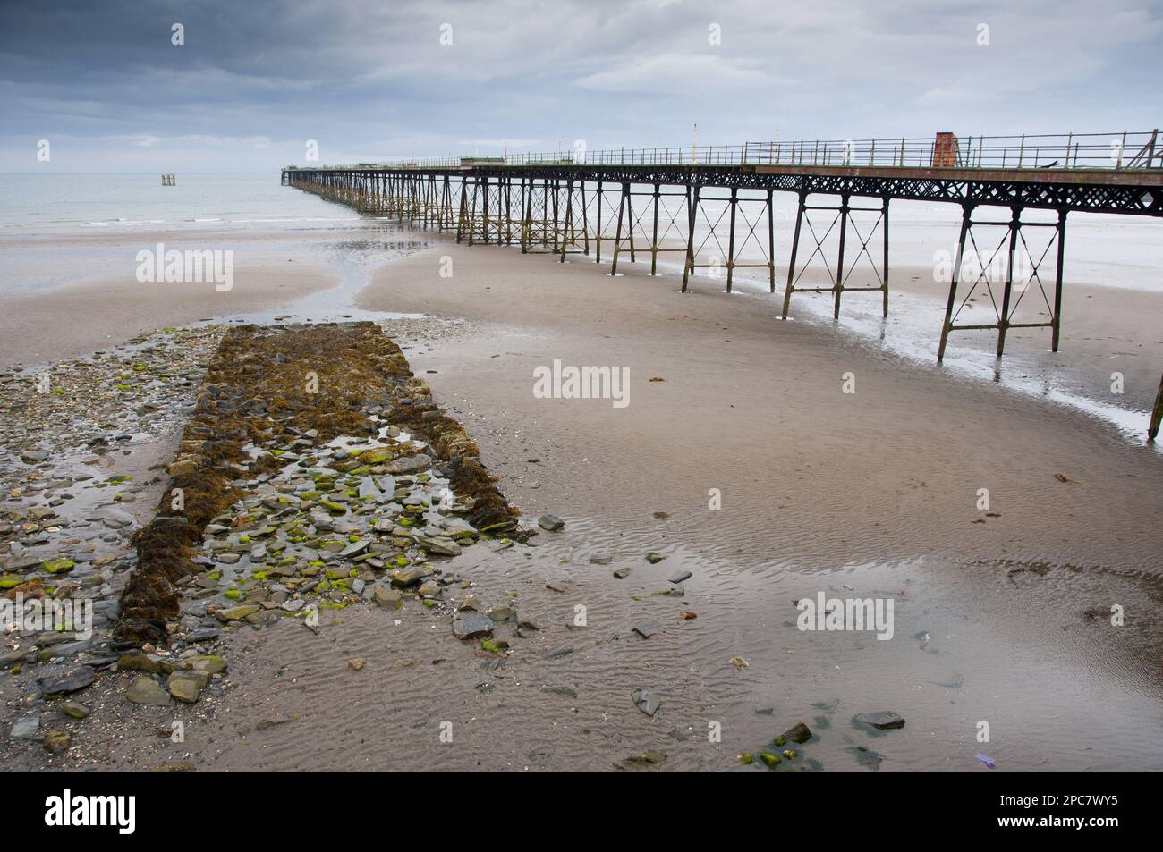 View of beach and enclosed iron pier, Queen's Pier, Ramsey, Isle of Man ...