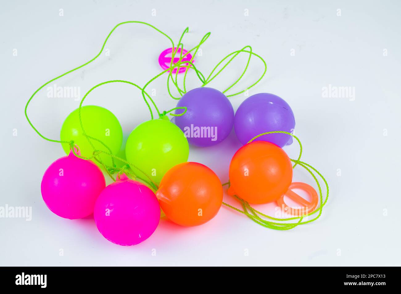 The traditional Indonesian game called lato lato. Isolated in white ...