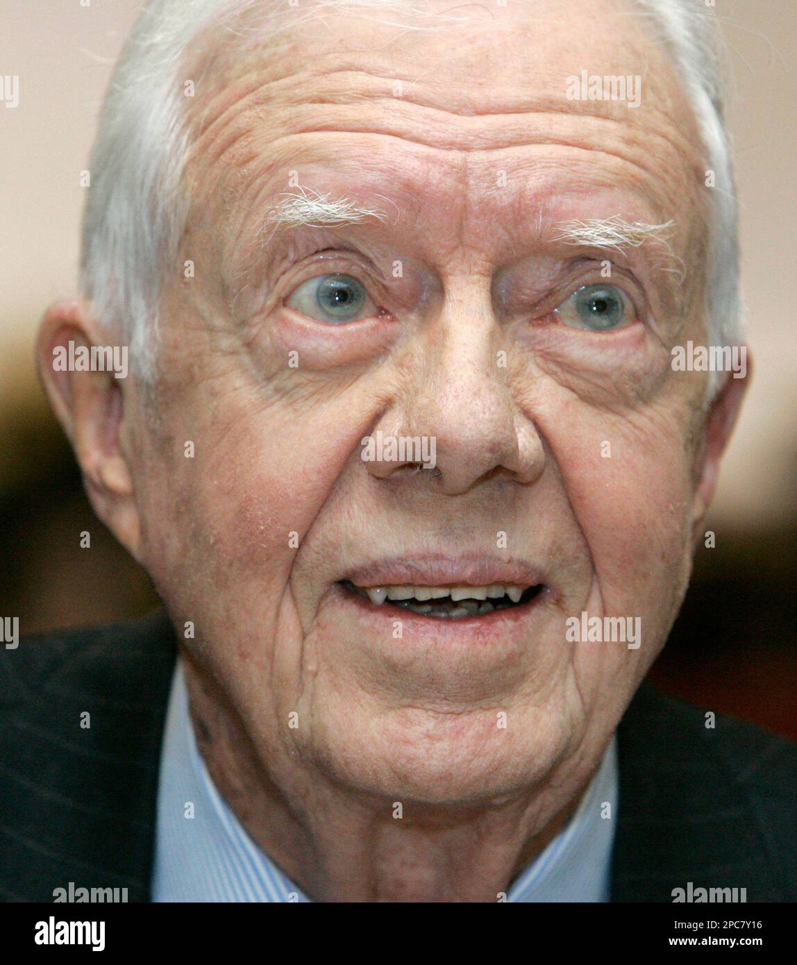 Former President Jimmy Carter signs copies of his book "Palestine ...