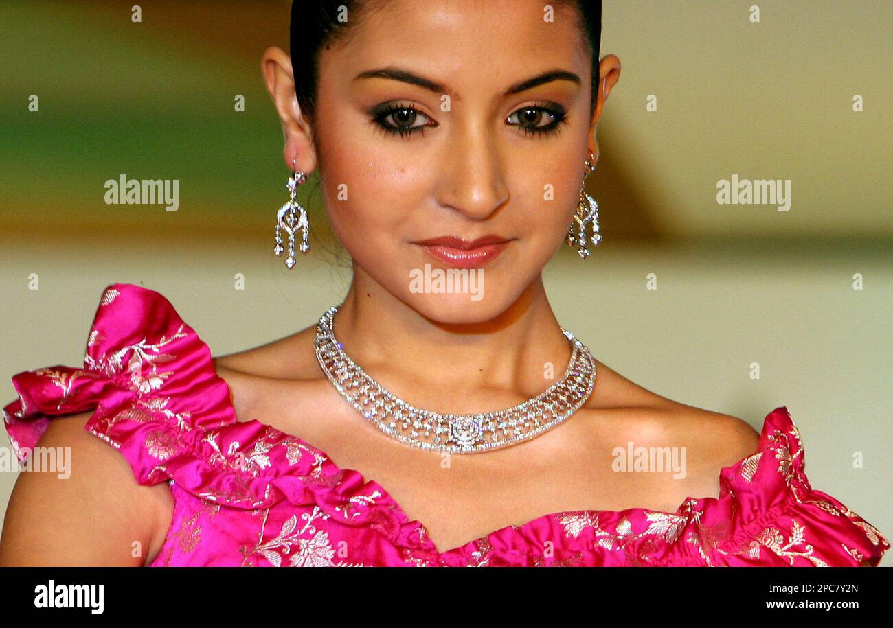 A model displays a necklace and earrings during a jewelry fashion show ...