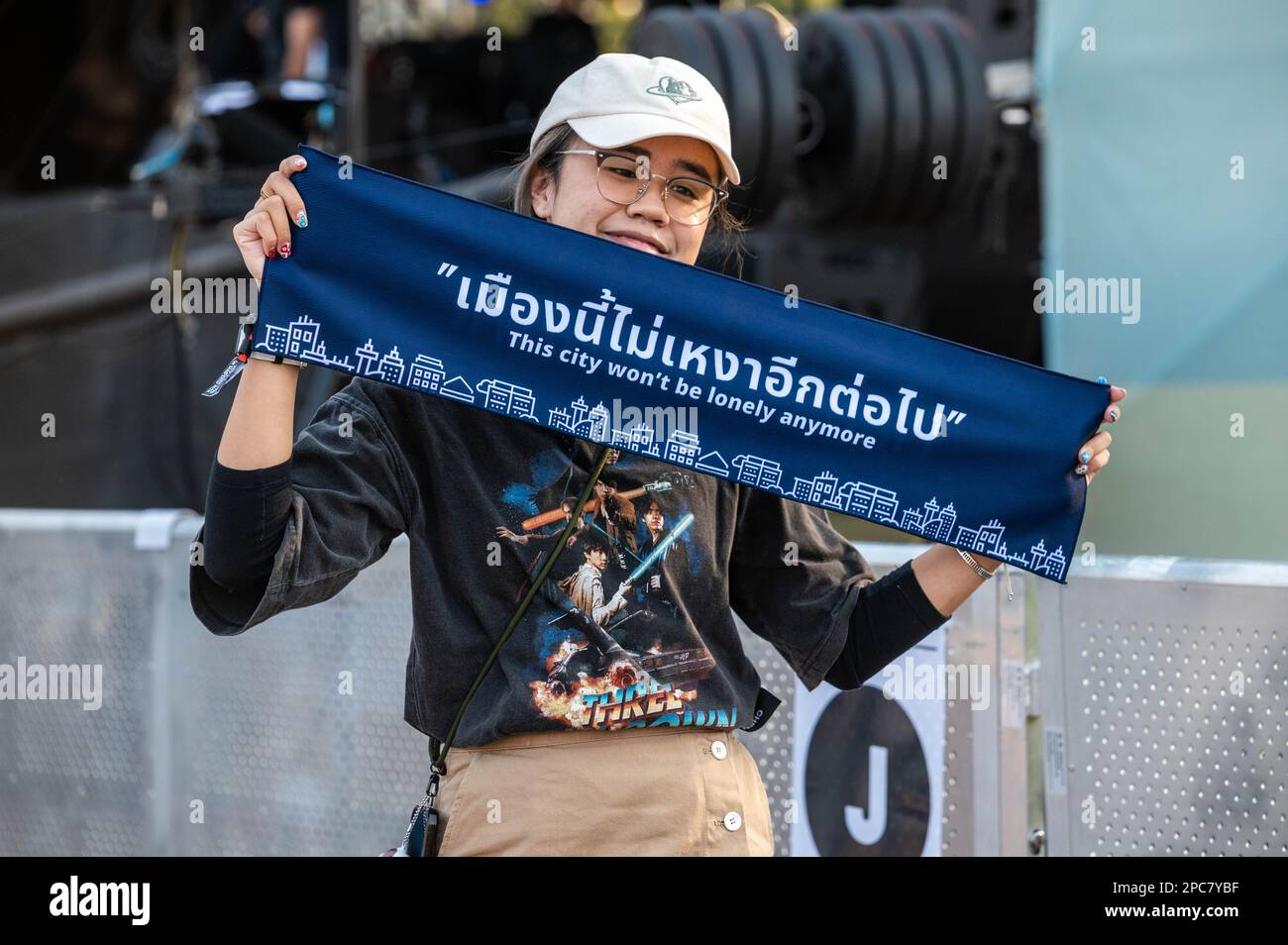 Hong Kong, China. 05th Mar, 2023. A fan of the Thai band Three Man Down holds up a banner in ...