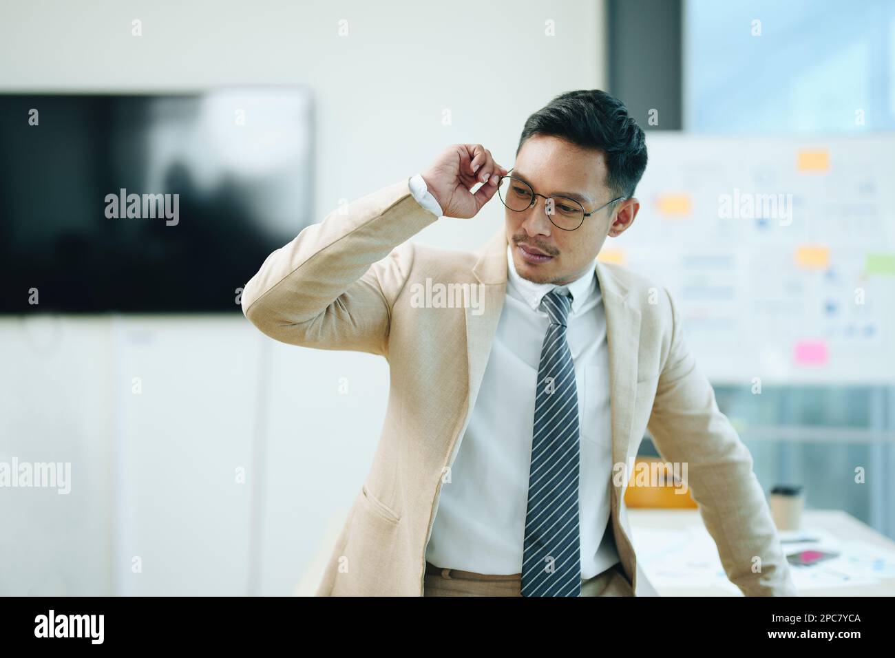 Portrait of a male business owner showing a happy smiling face as he ...