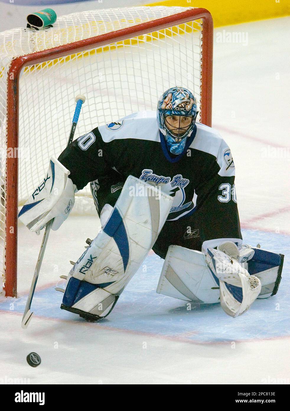 Tampa Bay Lightning goalie Marc Denis (30) watches a rebound against ...