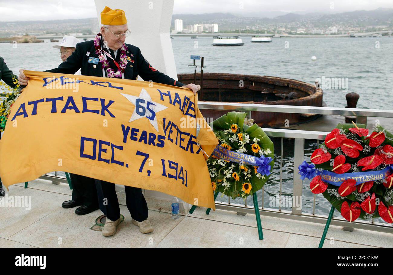 While standing in front of the partially submerged USS Arizona, Pearl ...