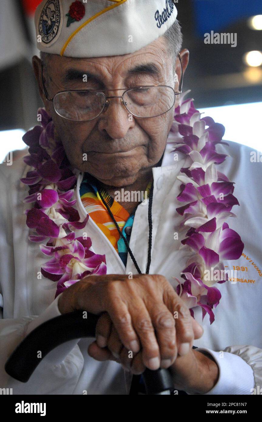Raymond Chavez, 94, of San Diego, bows his head in prayer during a ...
