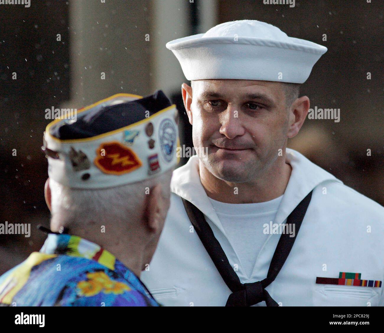 Pearl Harbor survivor Bob Seelie, left, speaks with Musician 2nd Class ...