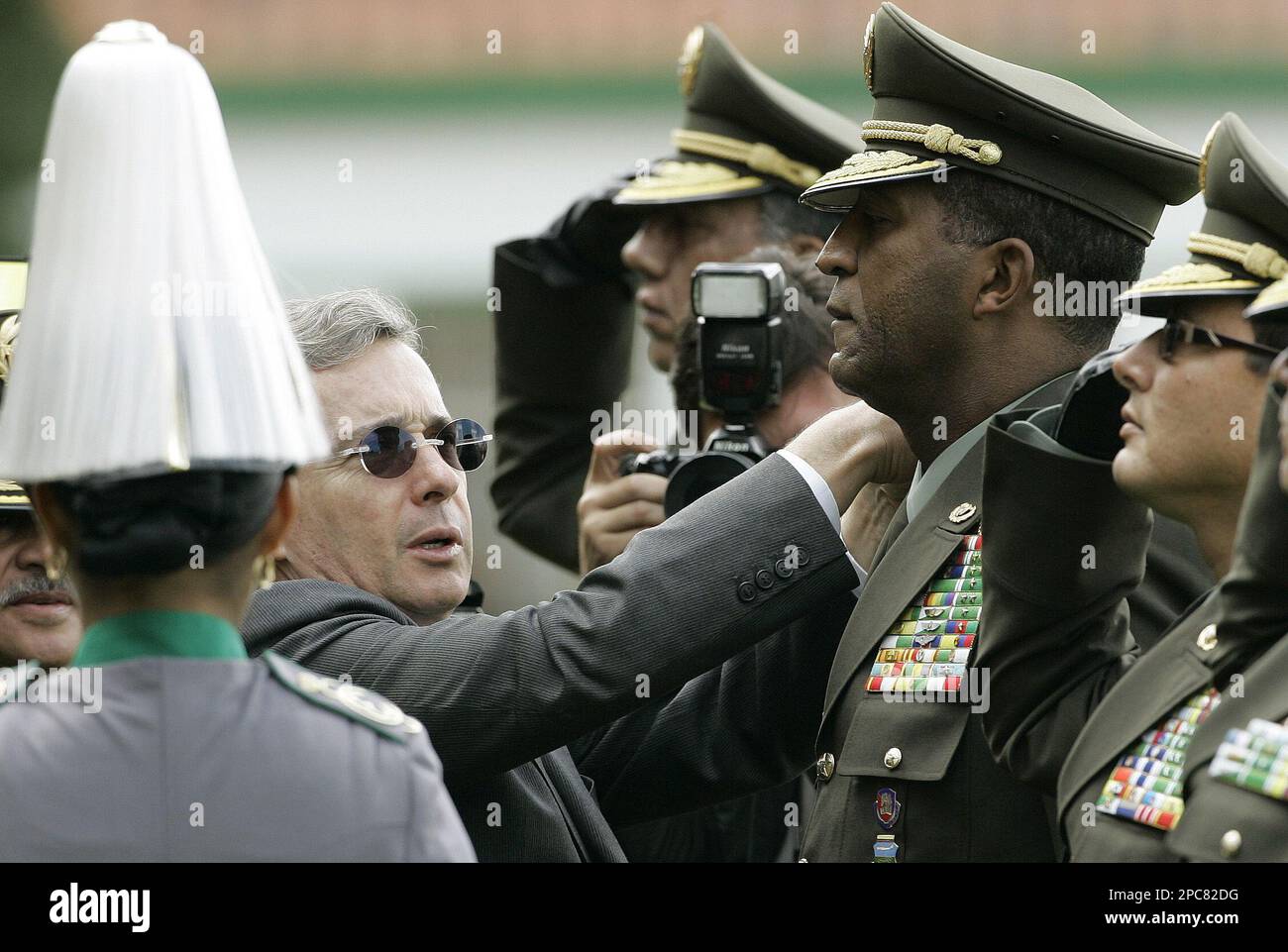 Colombia's President Alvaro Uribe, left, promotes the first afro ...