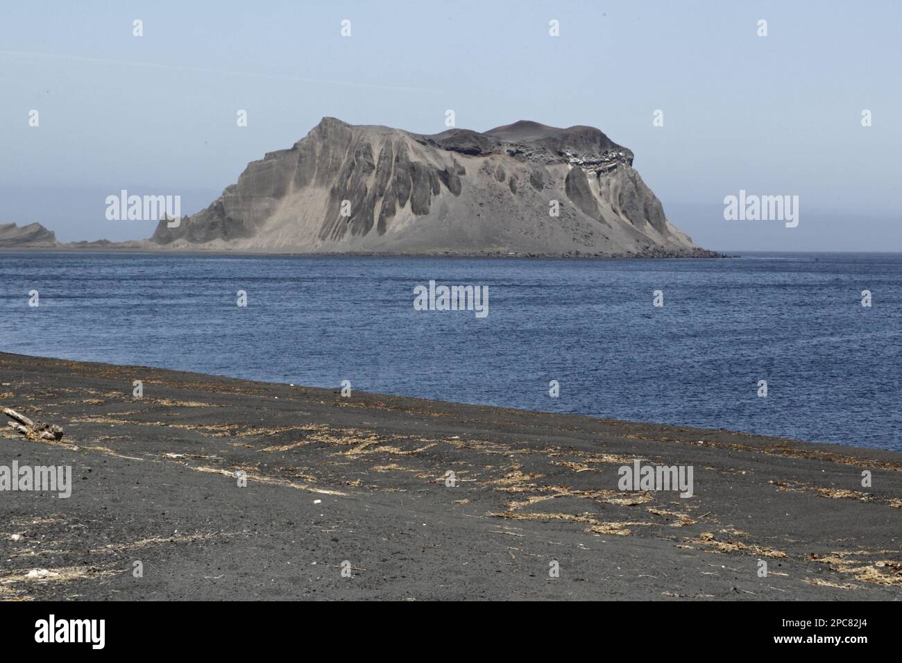 View of volcanic sand on the beach, Atlasova Island, Kuril Islands, Sea ...