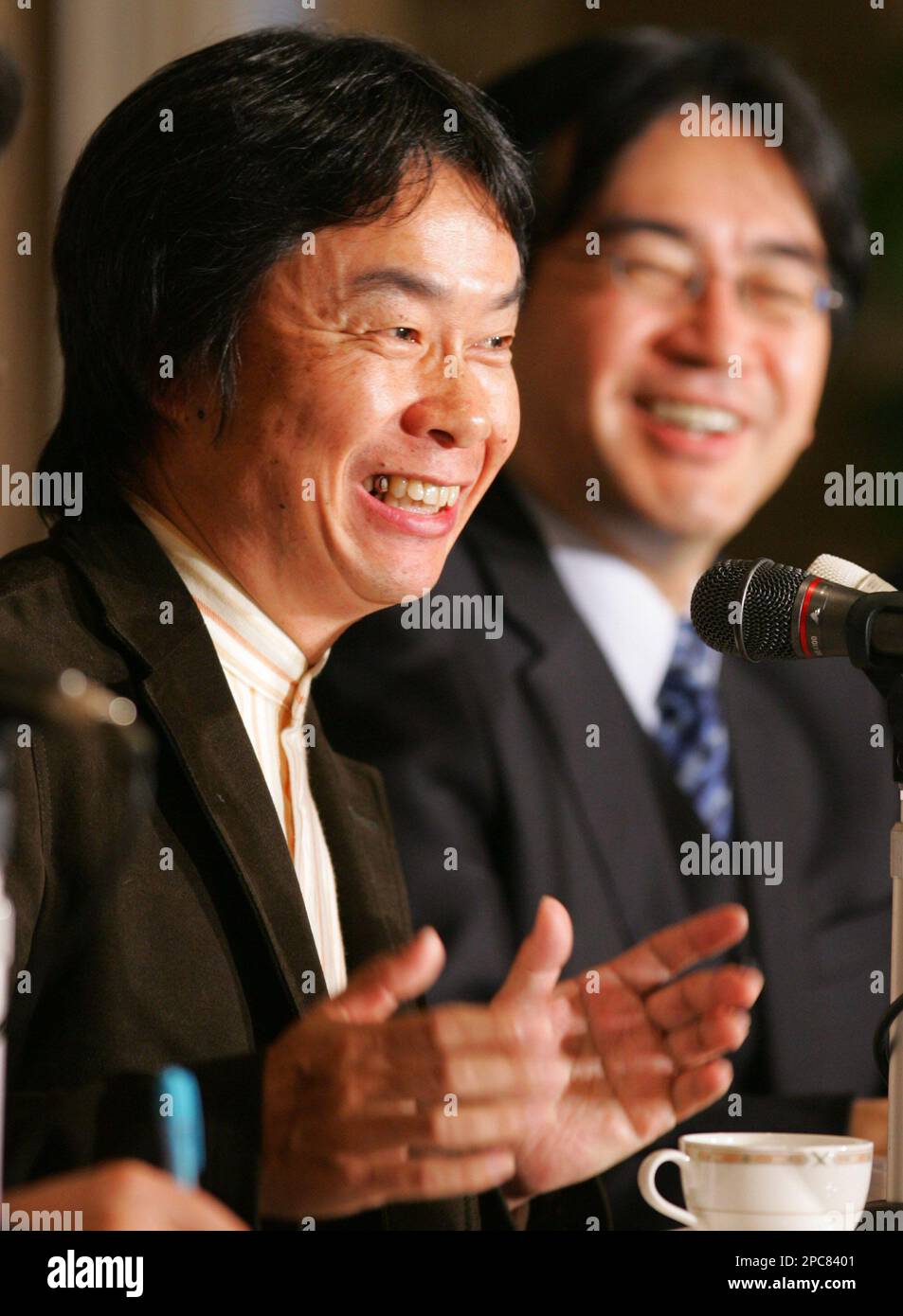 Nintendo Co. game designer Shigeru Miyamoto, left, accompanied by ...