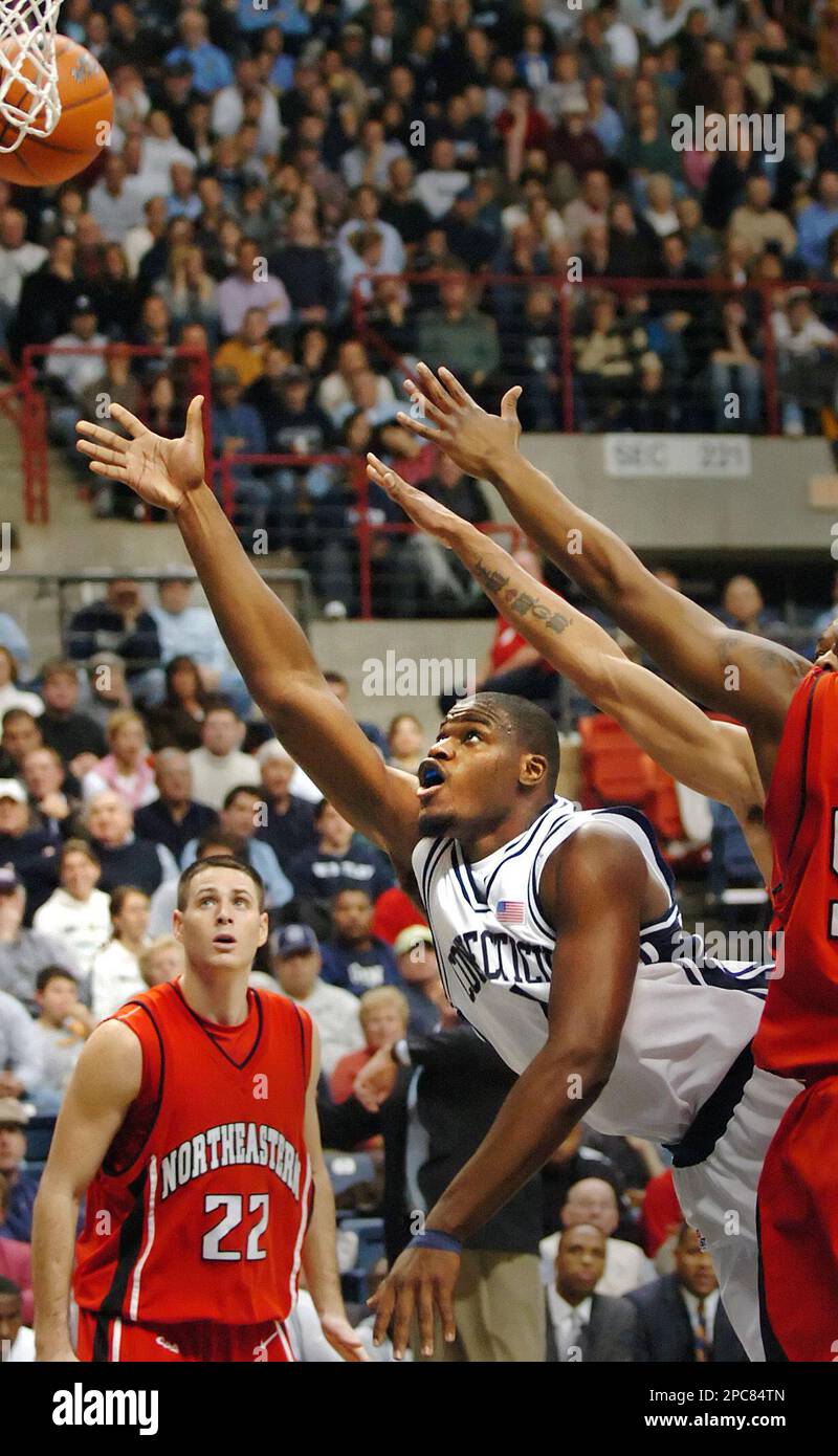 Connecticut's Jeff Adrien scores two of his career high 18 points as ...