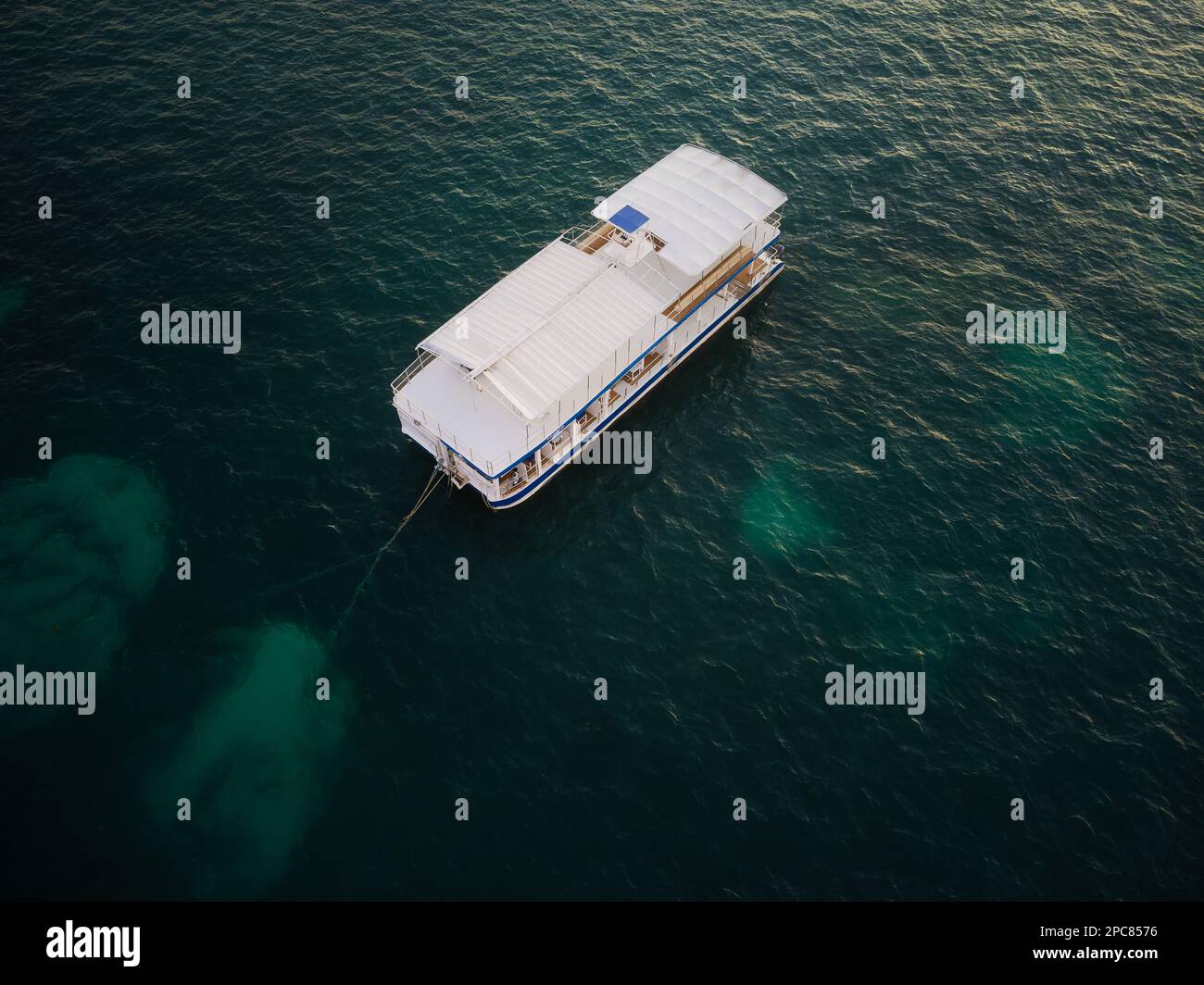 Shooting from a drone. White boat in the sea. Sea water is a beautiful ...