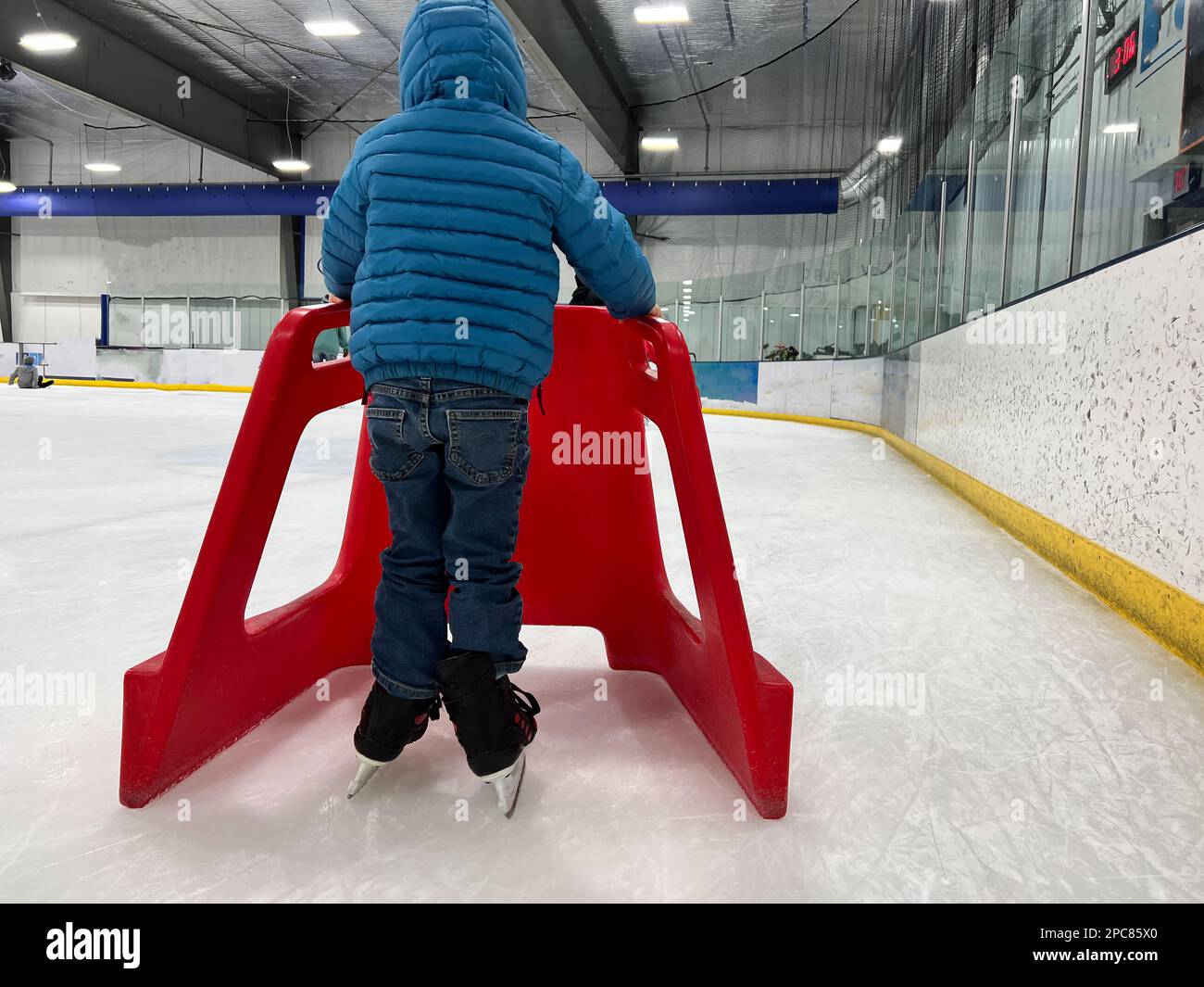 Beginner ice skater using a plastic walker for assistance Stock Photo ...