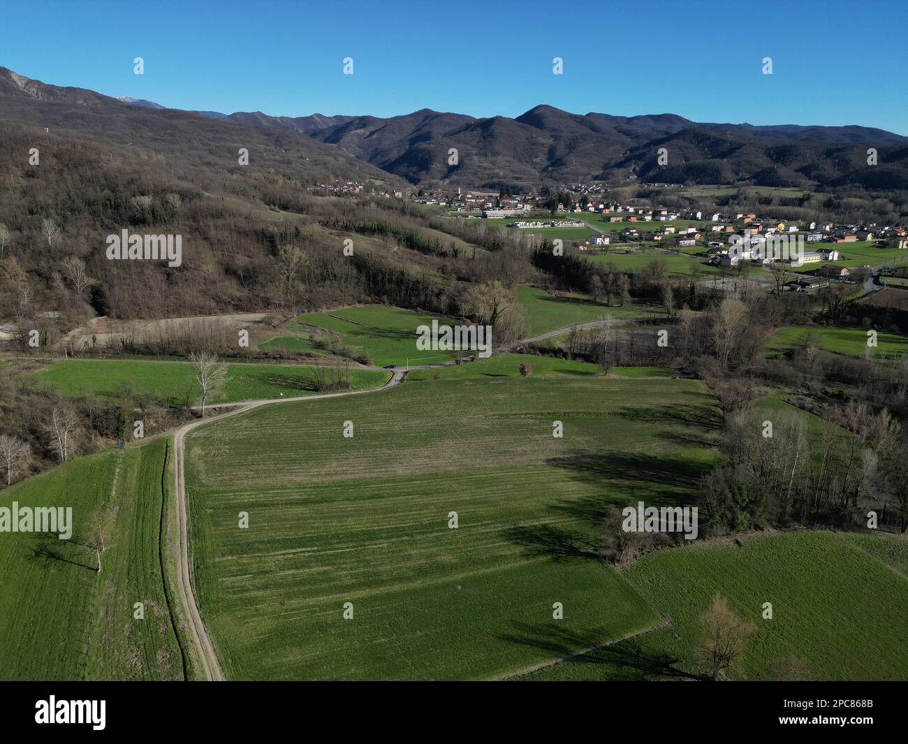 farmed fields of Borghetto di Borbera Peimonte Italy Village aerial ...
