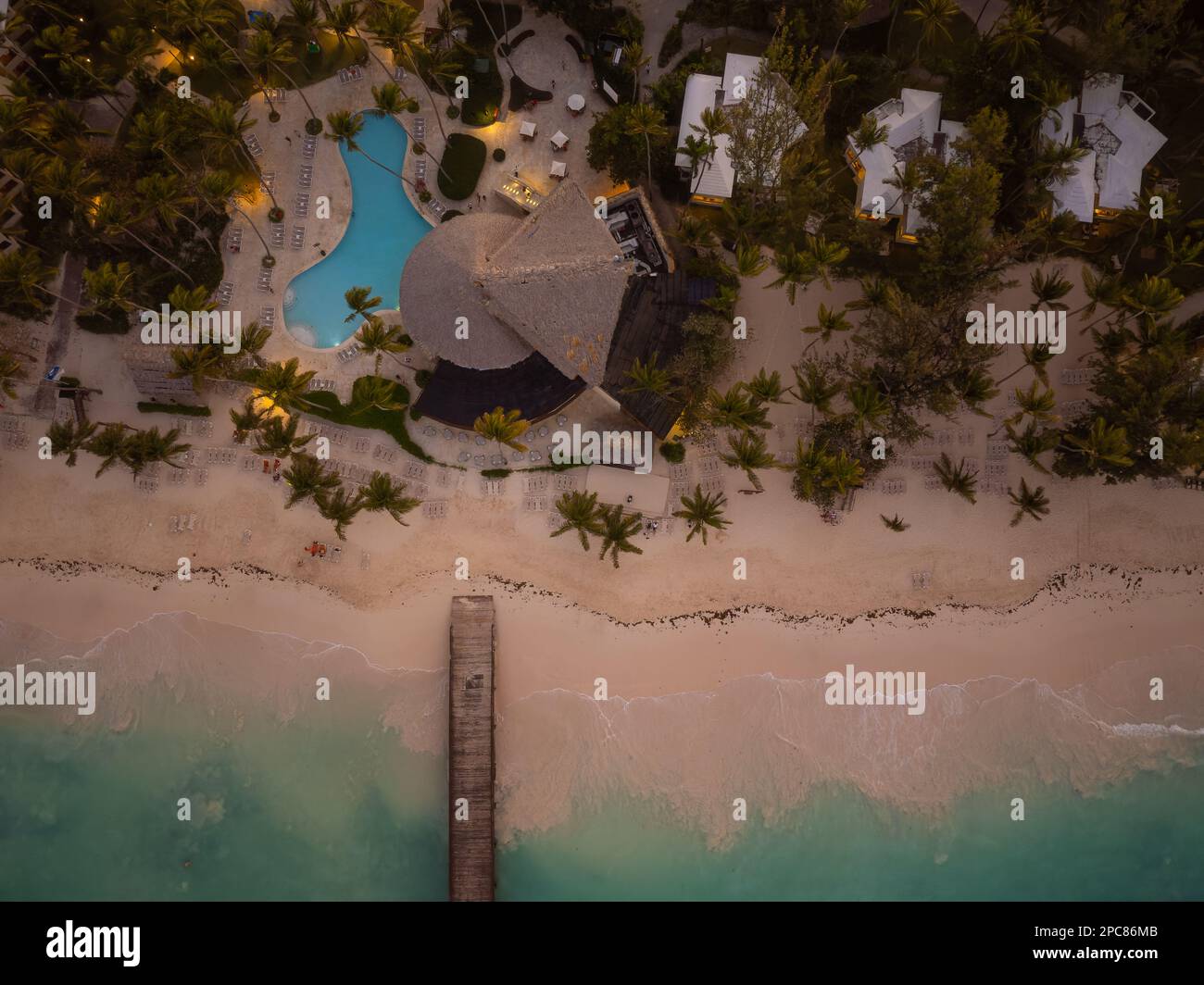 Wooden bridge in the sea. Aerial view. Smooth water surface and bridge ...