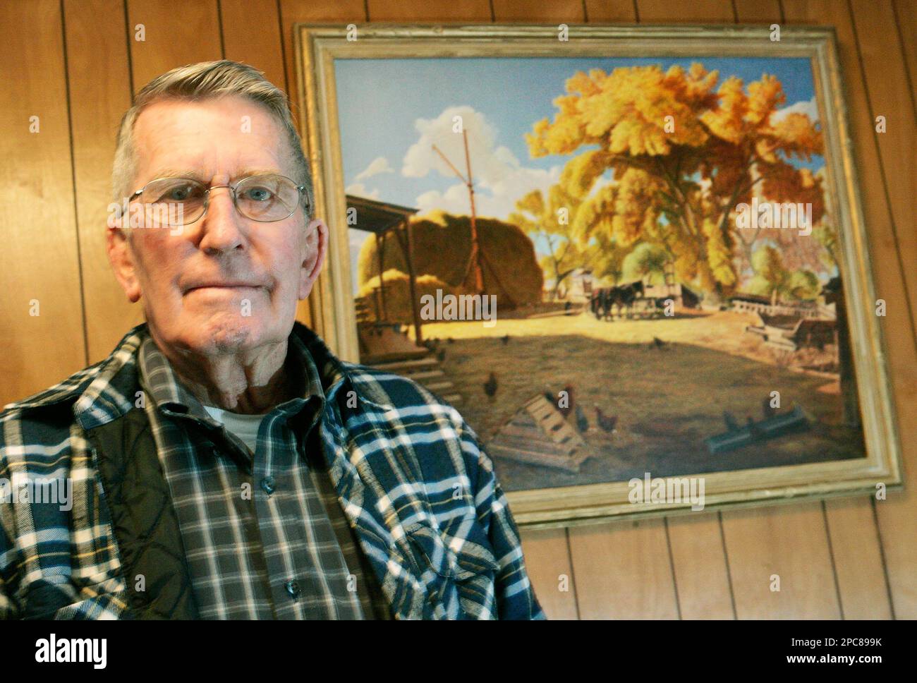 Stan Matlick poses with a 1950 painting of the barnyard on his family ...