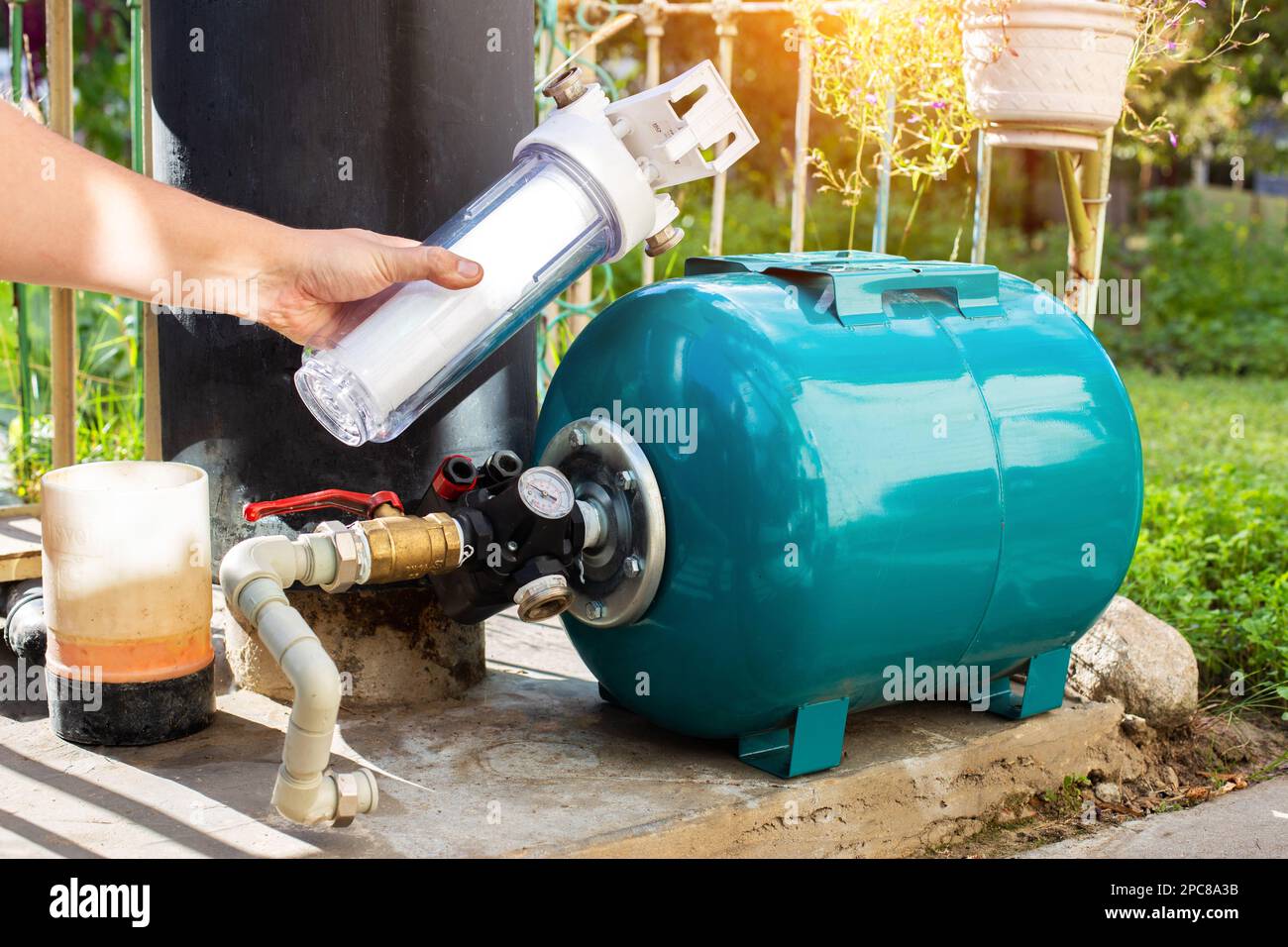 Water supply system from a well in a country house. New water filter ...