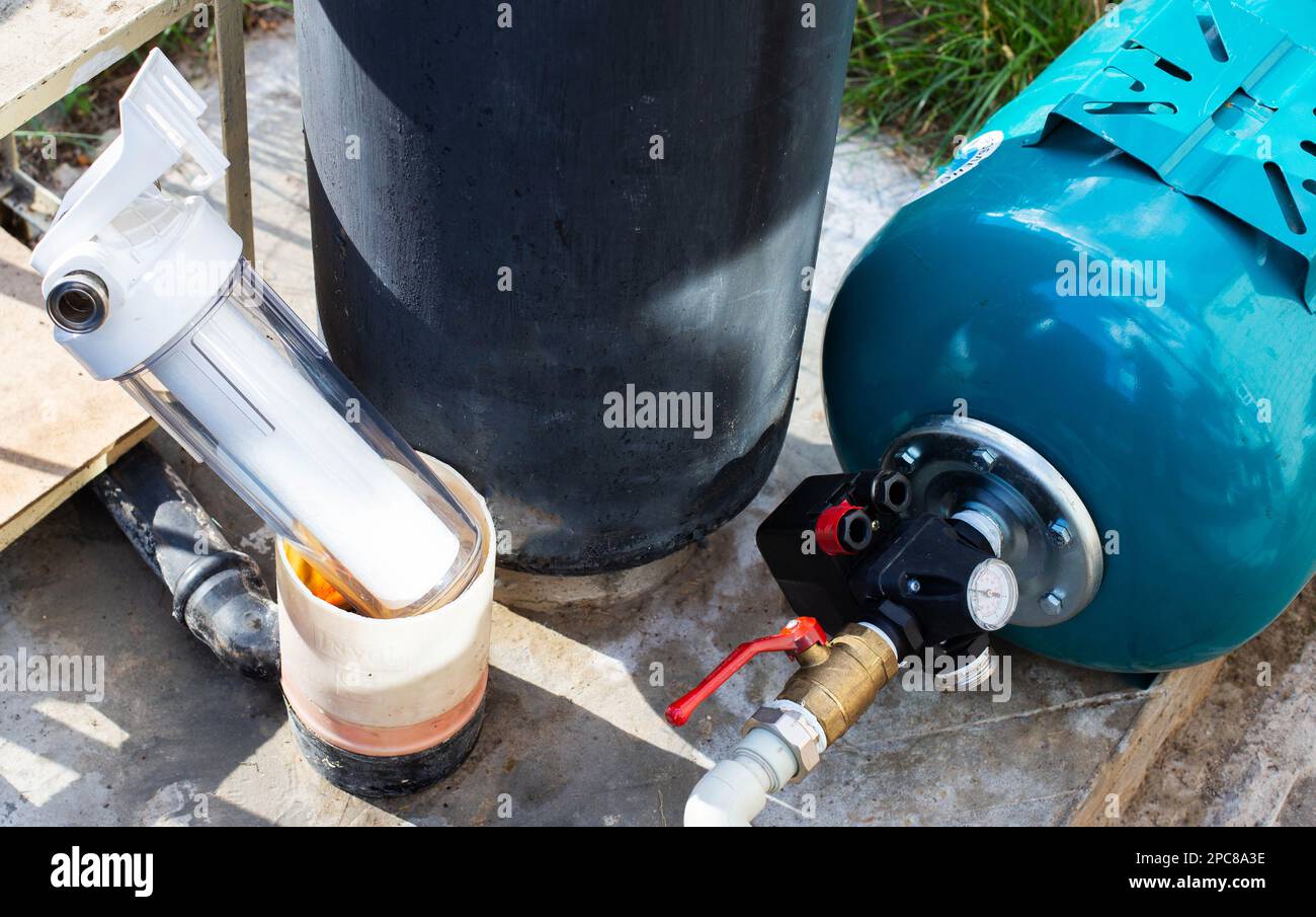 The system of modern water supply in a country house from a well source ...