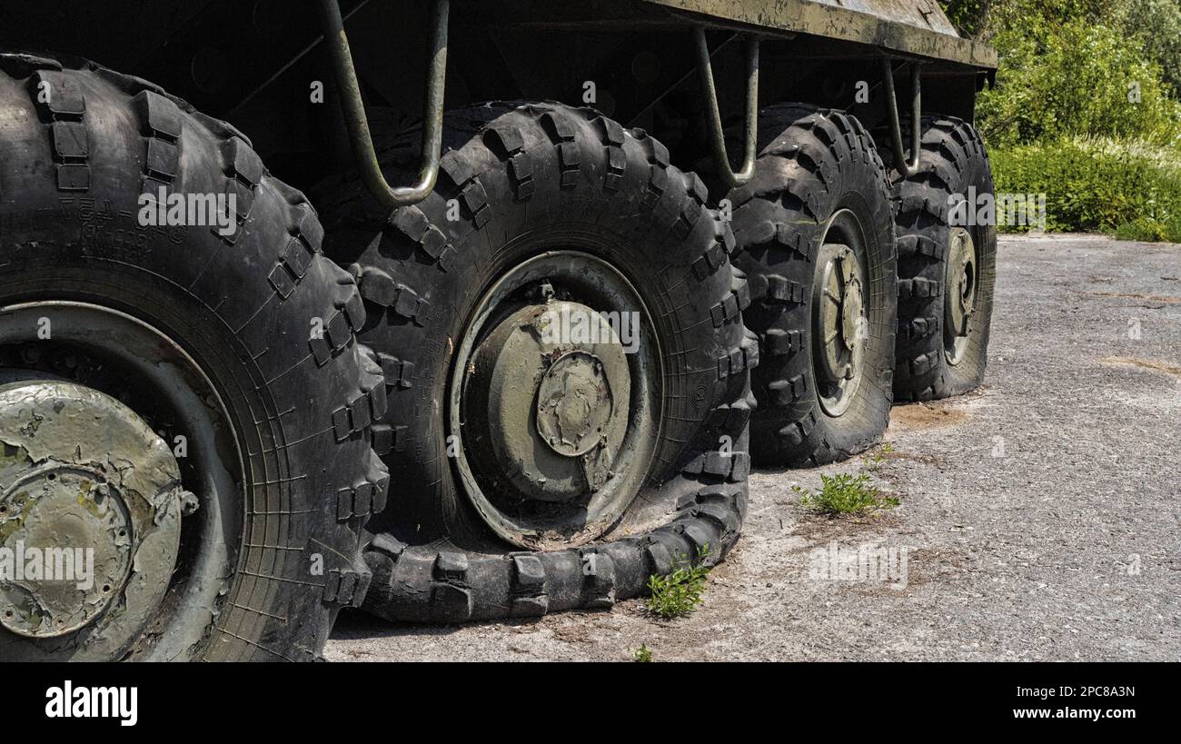 Flat and punctured wheels of armored personnel carriers during a ...