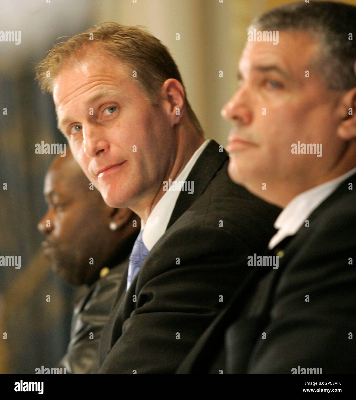 Emmitt Smith, left, Chad Hennings, center, and Chip Kell listen to ...