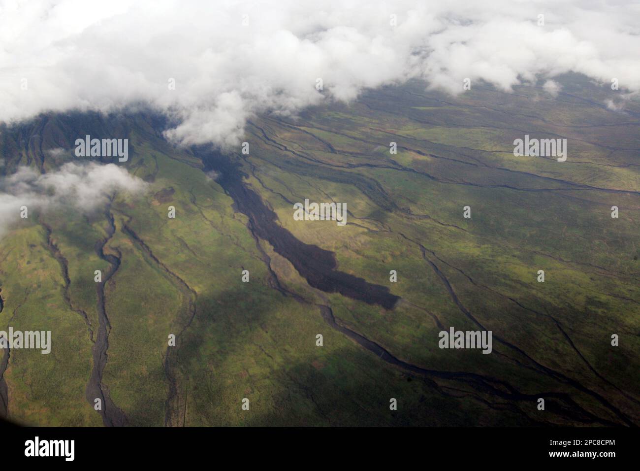 An aerial shot of cloud-covered Mayon volcano in Albay province, south ...