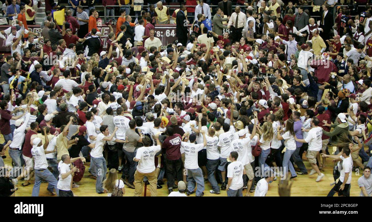 Florida State fans storm the court following the Seminoles 70-66 upset ...