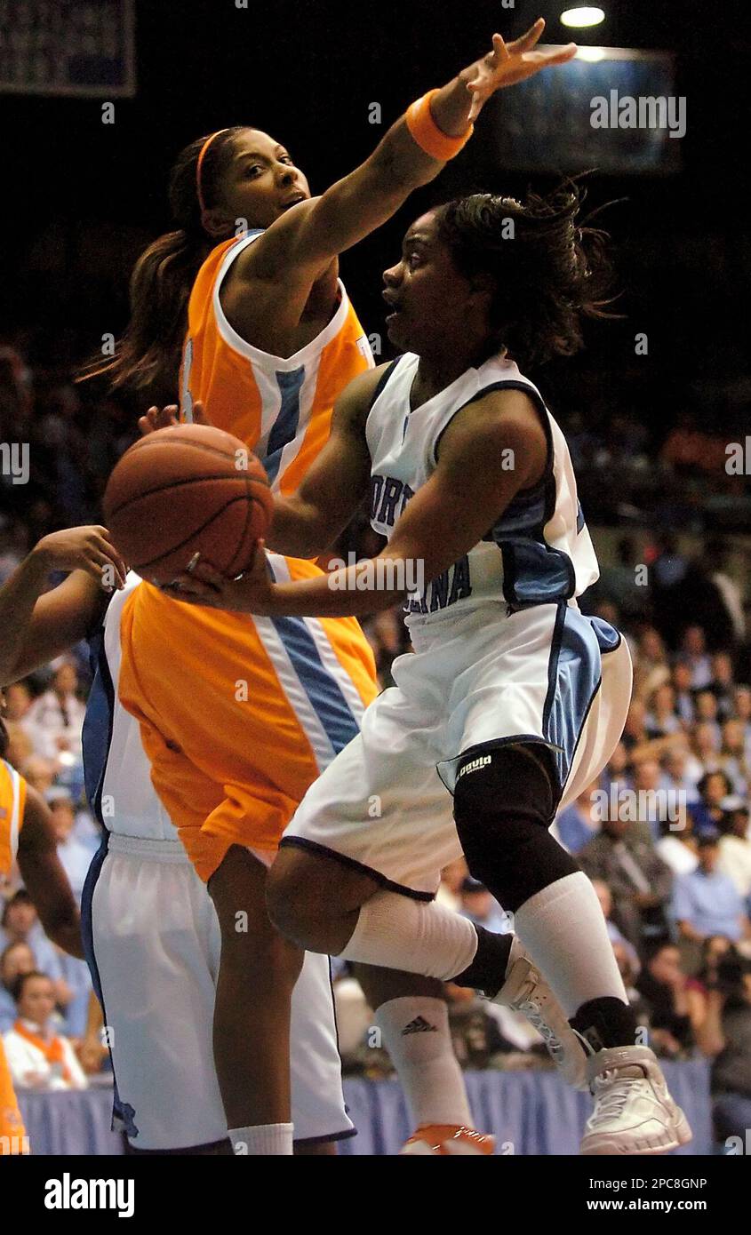 North Carolina's Ivory Latta, right, drives under Tennessee's Candace ...