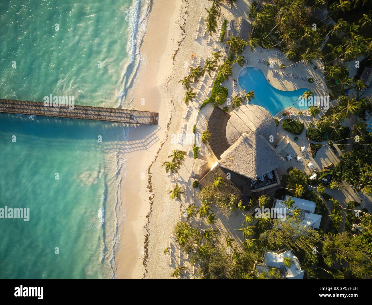 Resort town from a bird's eye view. Bungalows, pools, palm trees on a ...