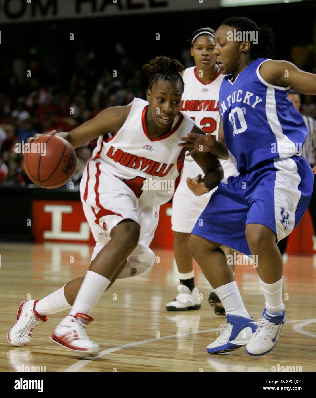 Louisville's Courtney Simmons, left, drives on Kentucky's Nastassia ...