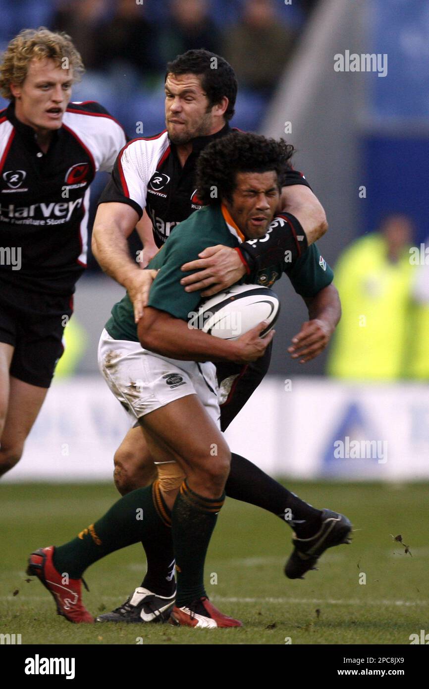 World 15's Andy Farrell, left, tackles South Africa's Bevin Fortuin ...