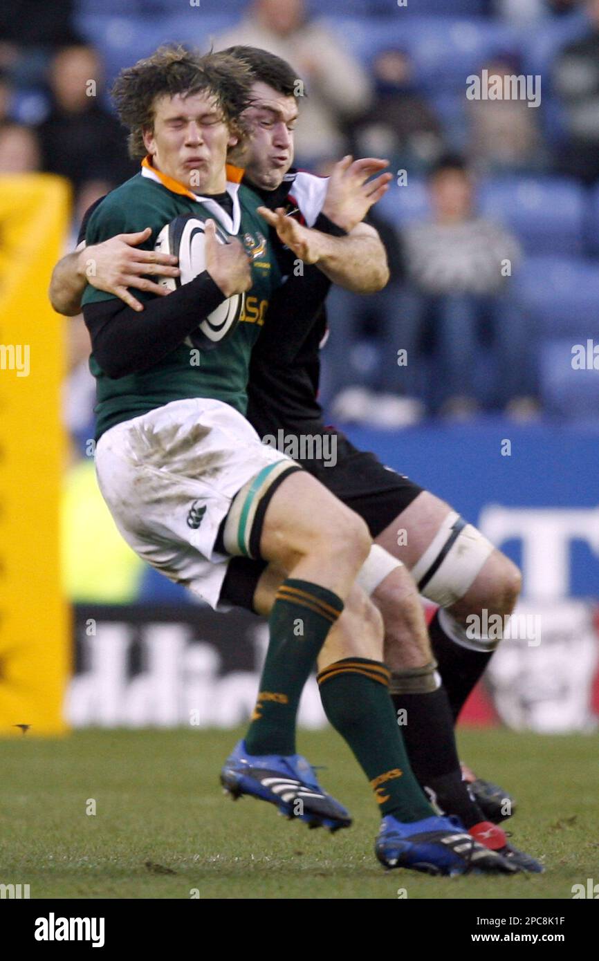 World 15's Wikus van Heerden, right, tackles by South Africa's Francois ...