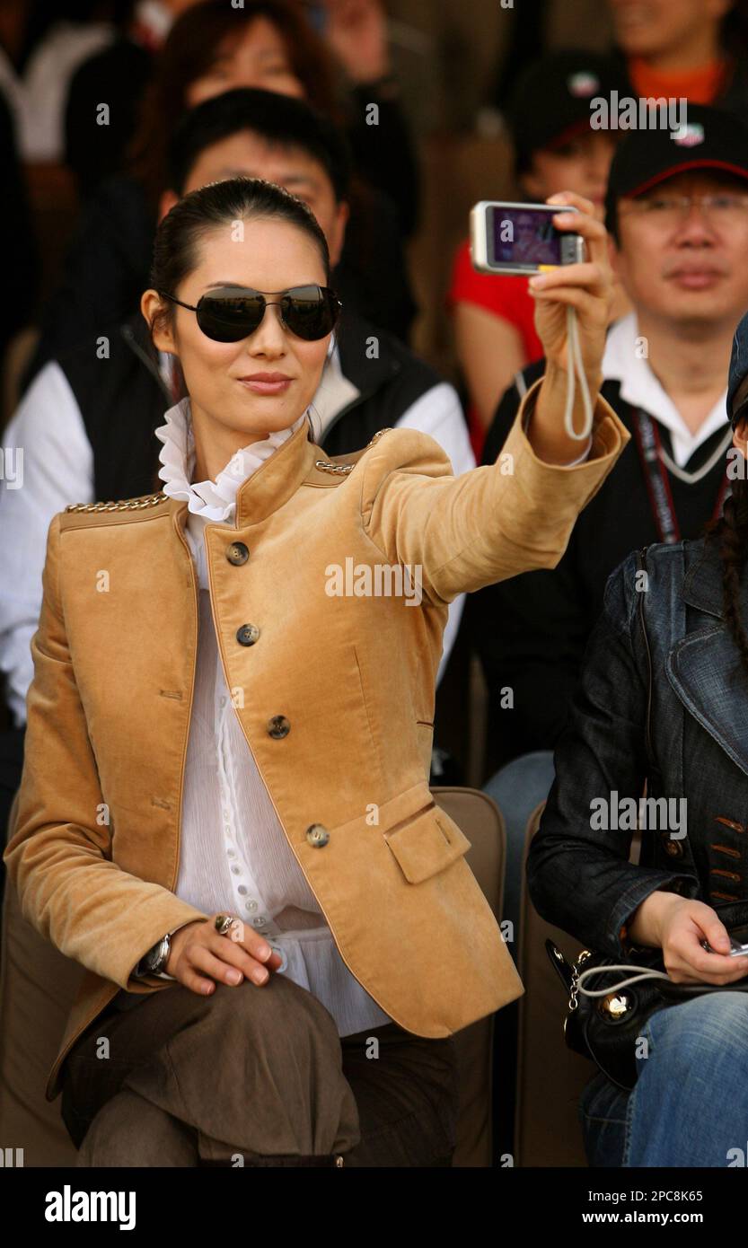 Chinese model and fashion designer Mary Ma takes her own photograph ...