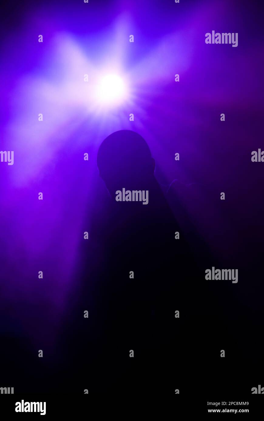 Man microphone on light hi-res stock photography and images - Alamy