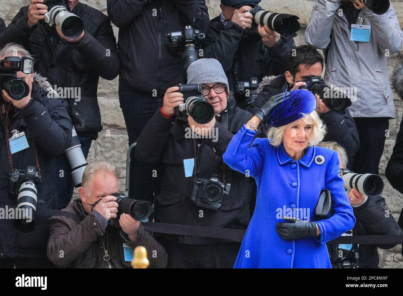 London, UK. 13th Mar, 2023. Camilla holds on to her hat in the windy ...