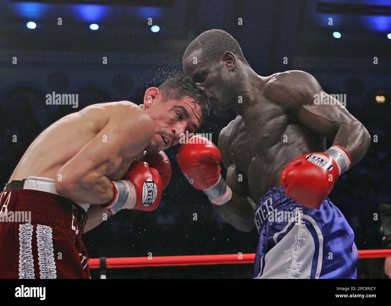 Joshua Clottey, right, punches Antonio Margarito, left, of Tijuana ...