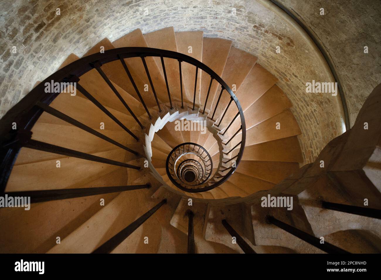 Ancient castle tower interior with spiral staircase leading down Stock ...