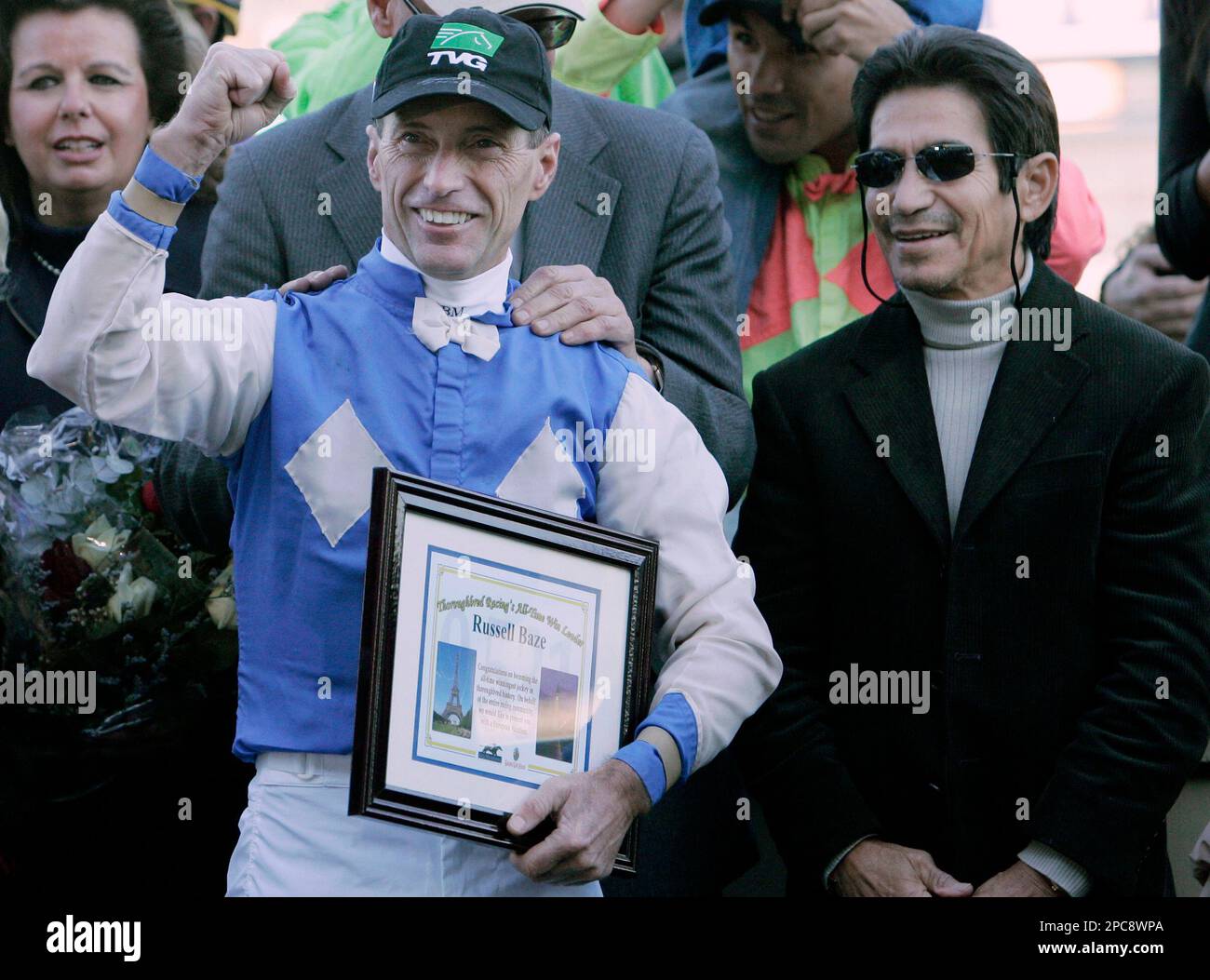 Jockey Russell Baze, left, celebrates with former jockey Laffit Pincay ...