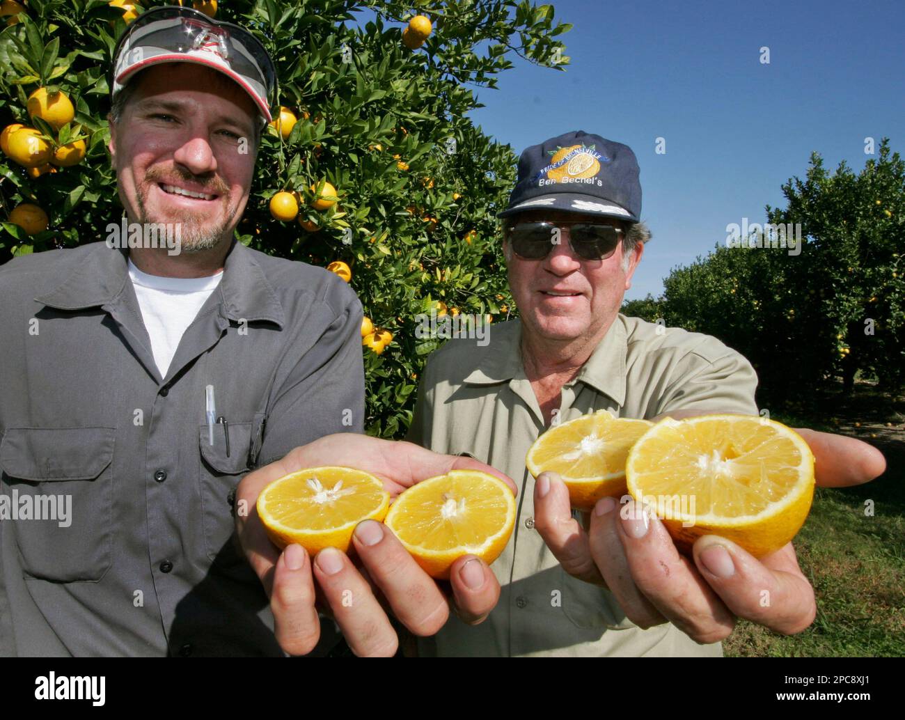 Ben Becnel Jr., and his father Ben Becnel Sr., pose for a photograph ...