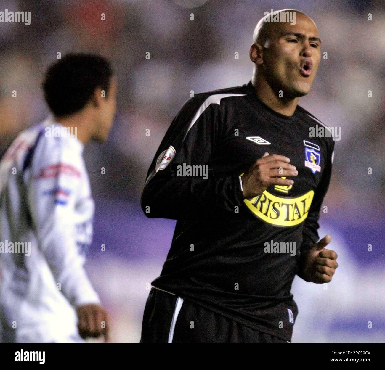 Humberto Suazo, right, of Chile's Colo Colo, reacts after a missed ...
