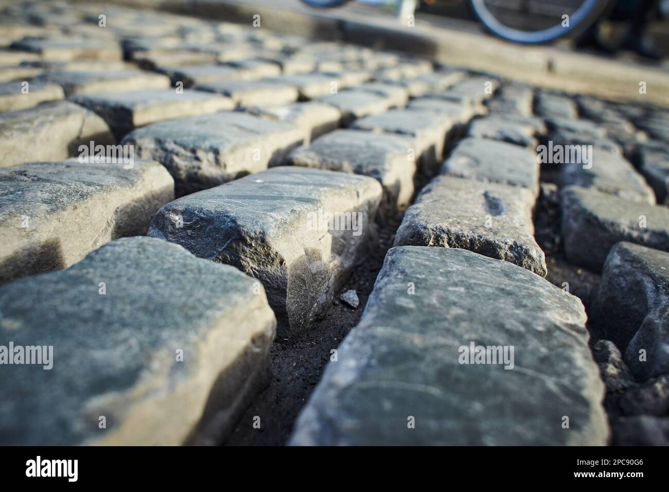 Old Pavement. Close up of old gray pavement with bike in blured on ...