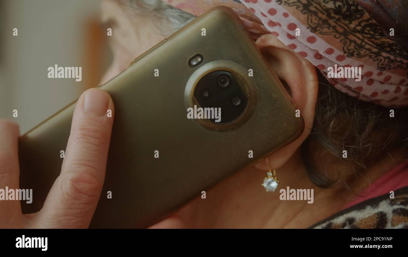 Keeping in Touch: Close-Up of Senior Woman Using Smartphone to Talk ...