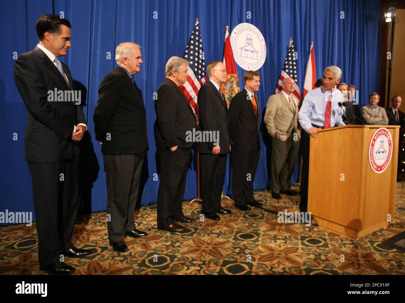 Florida Gov.-elect Charlie Crist, at podium, talks at a press ...
